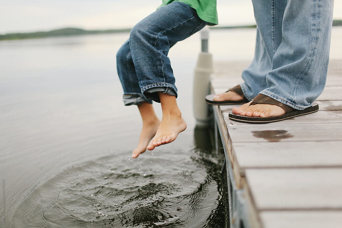 "Father Dangles His Son Over Water" by Stocksy Contributor "Kelly Knox ...