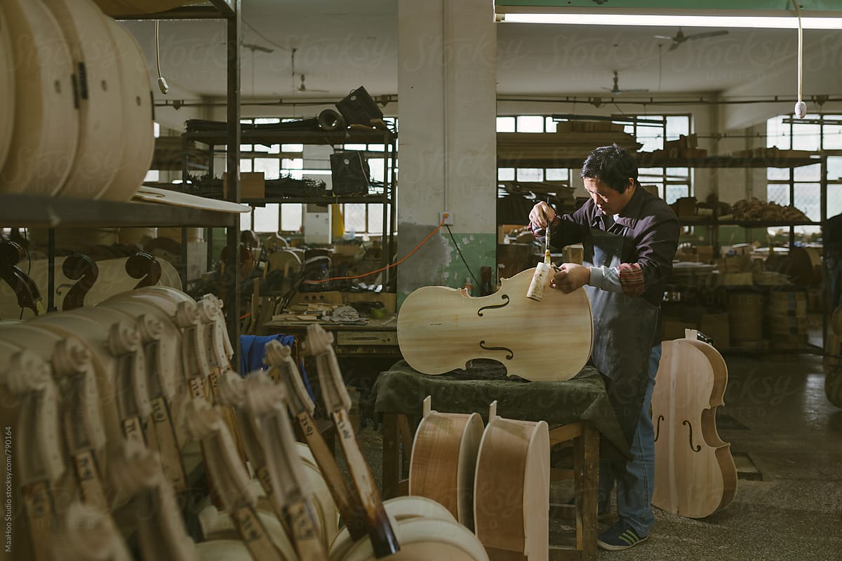 "Violin Maker At Work" by Stocksy Contributor "MaaHoo" - Stocksy