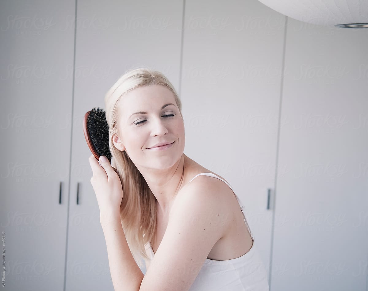 "Getting Ready In The Morning, And Brushing Hair." by Stocksy ...