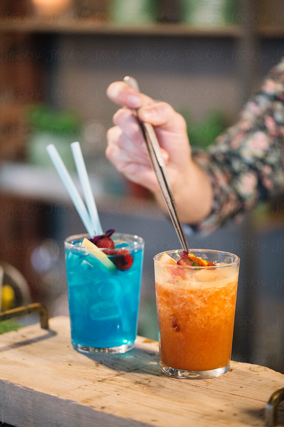"Barman Serving Cocktail" by Stocksy Contributor "Studio Serra" - Stocksy