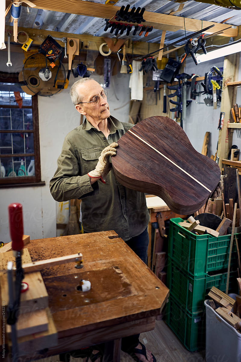 "Retirement Guitar Making Hobby" by Stocksy Contributor "Juno" - Stocksy