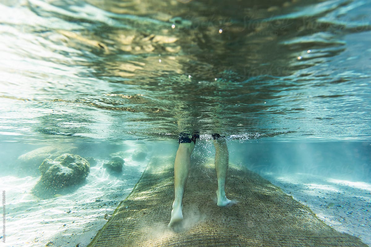 "Walking Out Of The Water" by Stocksy Contributor "Adam Nixon" - Stocksy