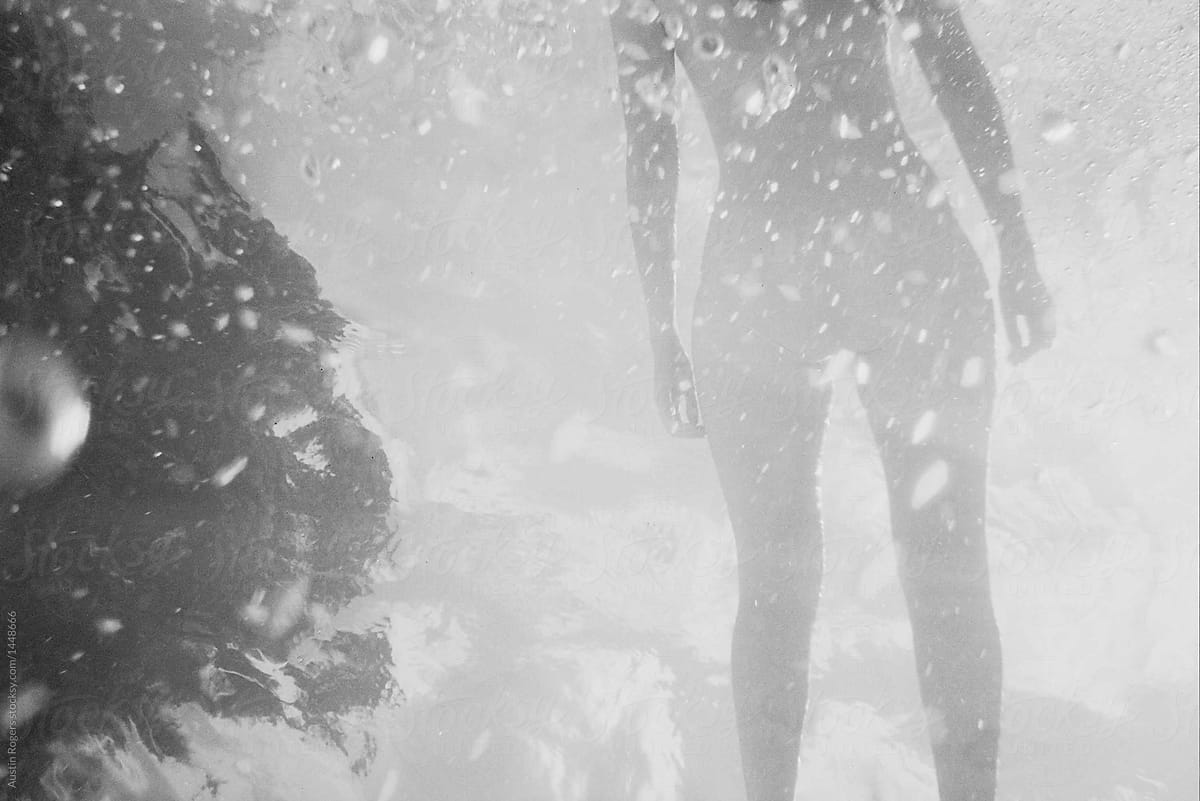 "Underwater Film Image Of Young Woman Floating On Surface Of Water" by ...