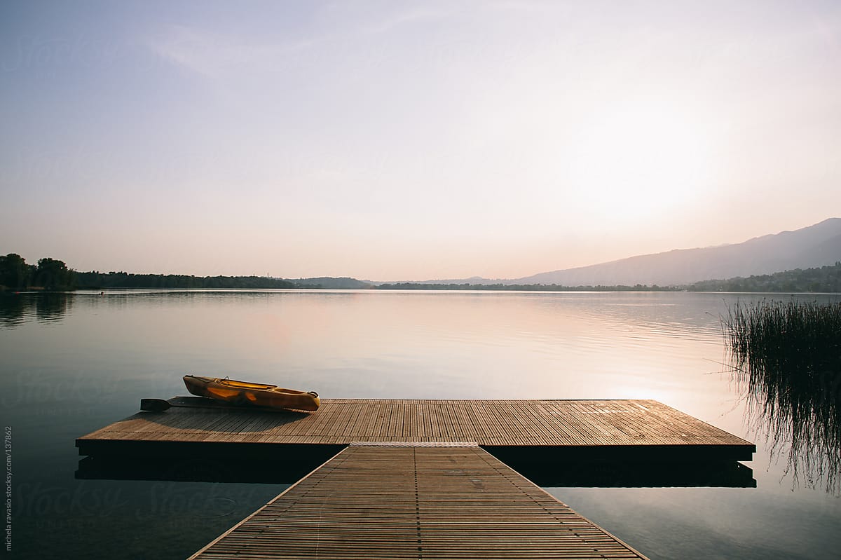 "Canoe On The Pier" by Stocksy Contributor "Michela Ravasio" - Stocksy