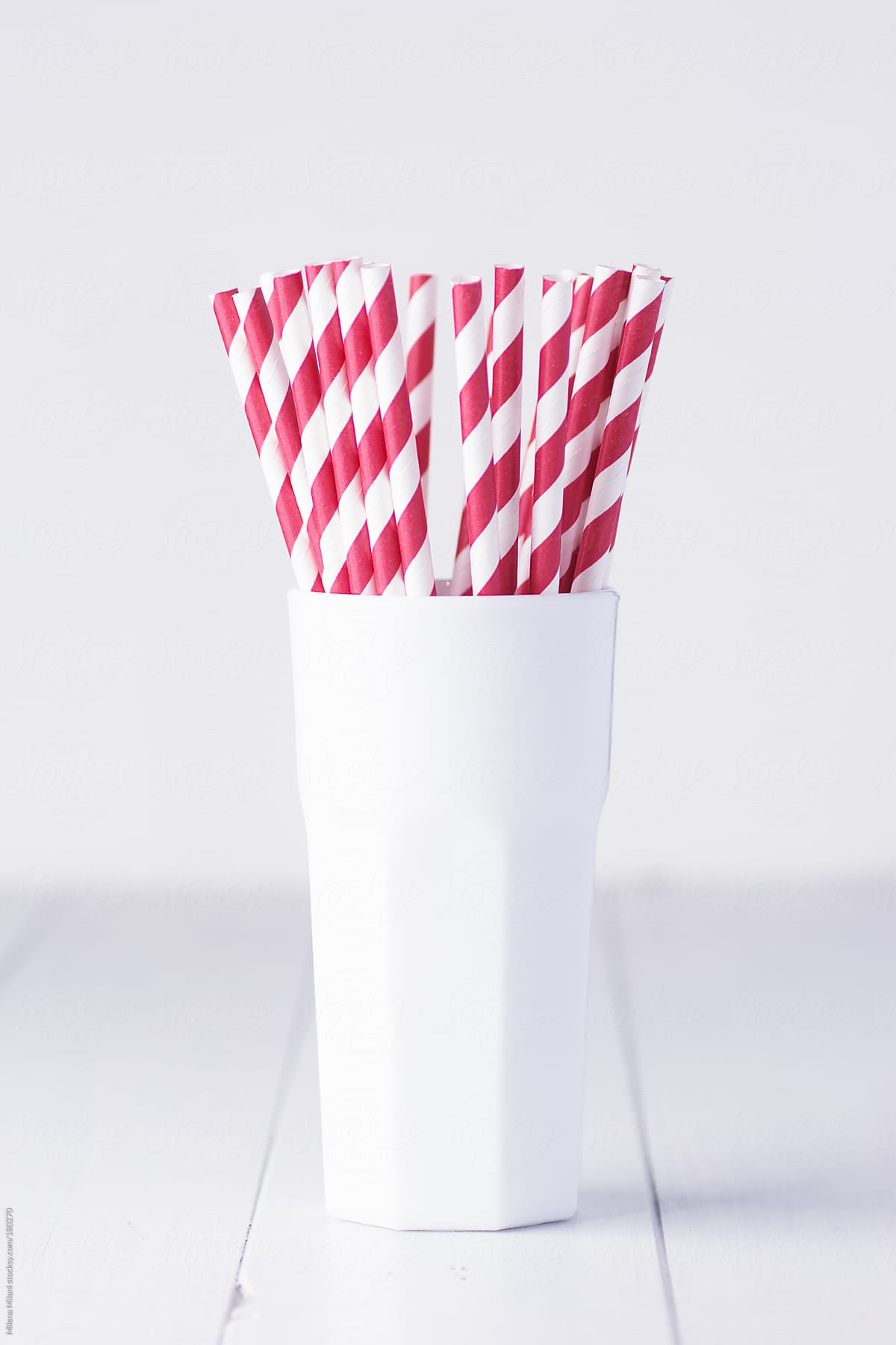 "Red Paper Straws" by Stocksy Contributor "Milena Milani" - Stocksy