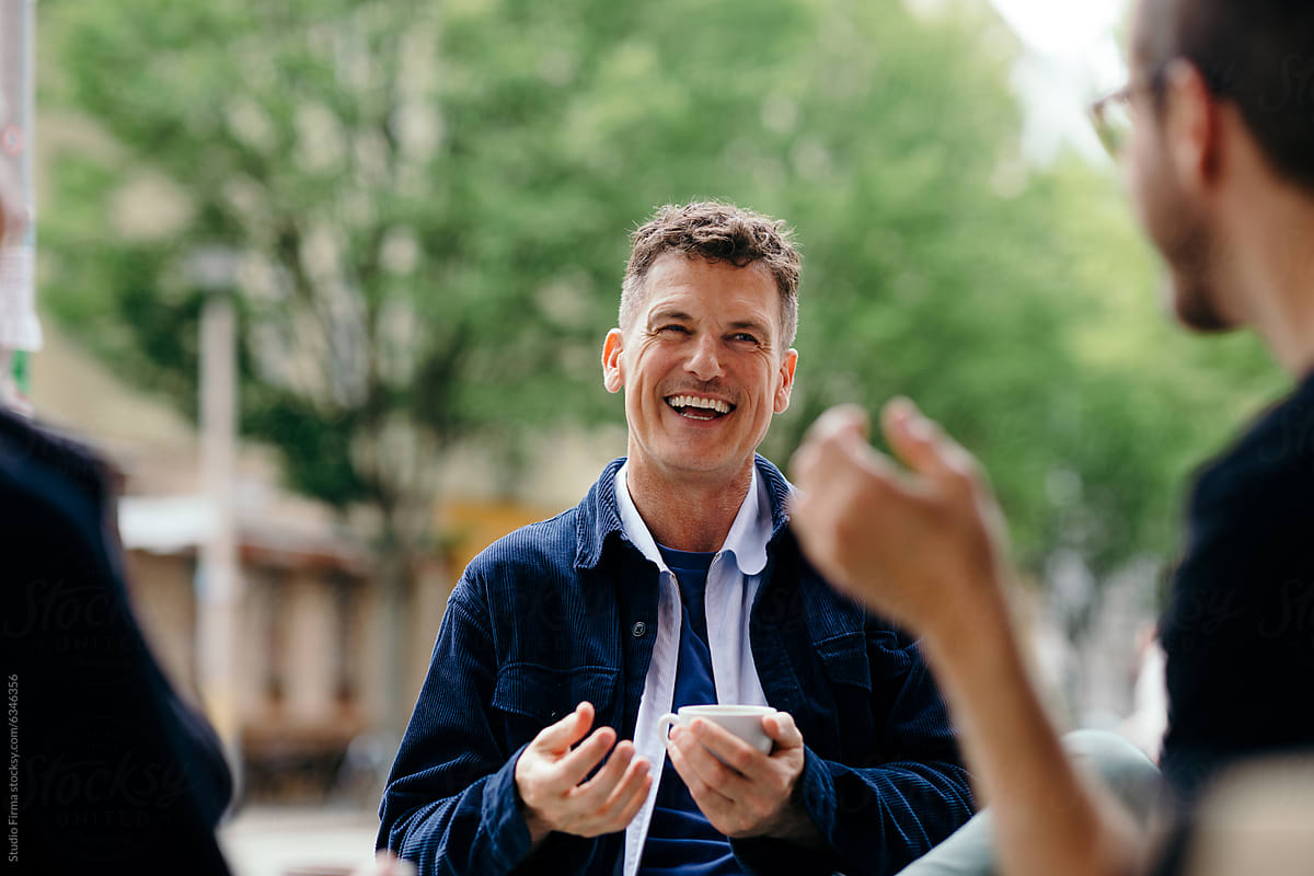 "Laughing With Friends" by Stocksy Contributor "Studio Firma" - Stocksy