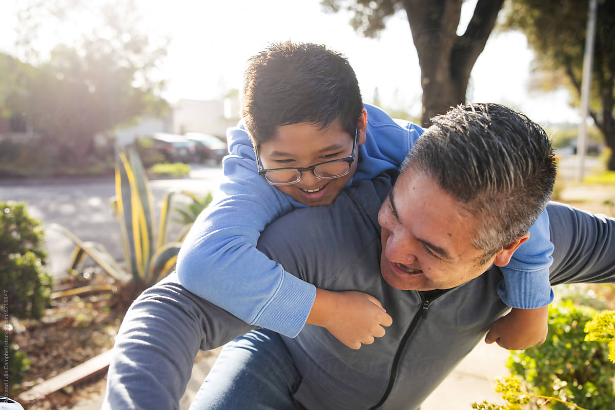 "Joyful Father And Son Bonding Outdoors On A Sunny Day" by Stocksy ...