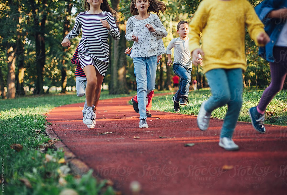 "Kids Running Outdoors" by Stocksy Contributor "Lumina" - Stocksy