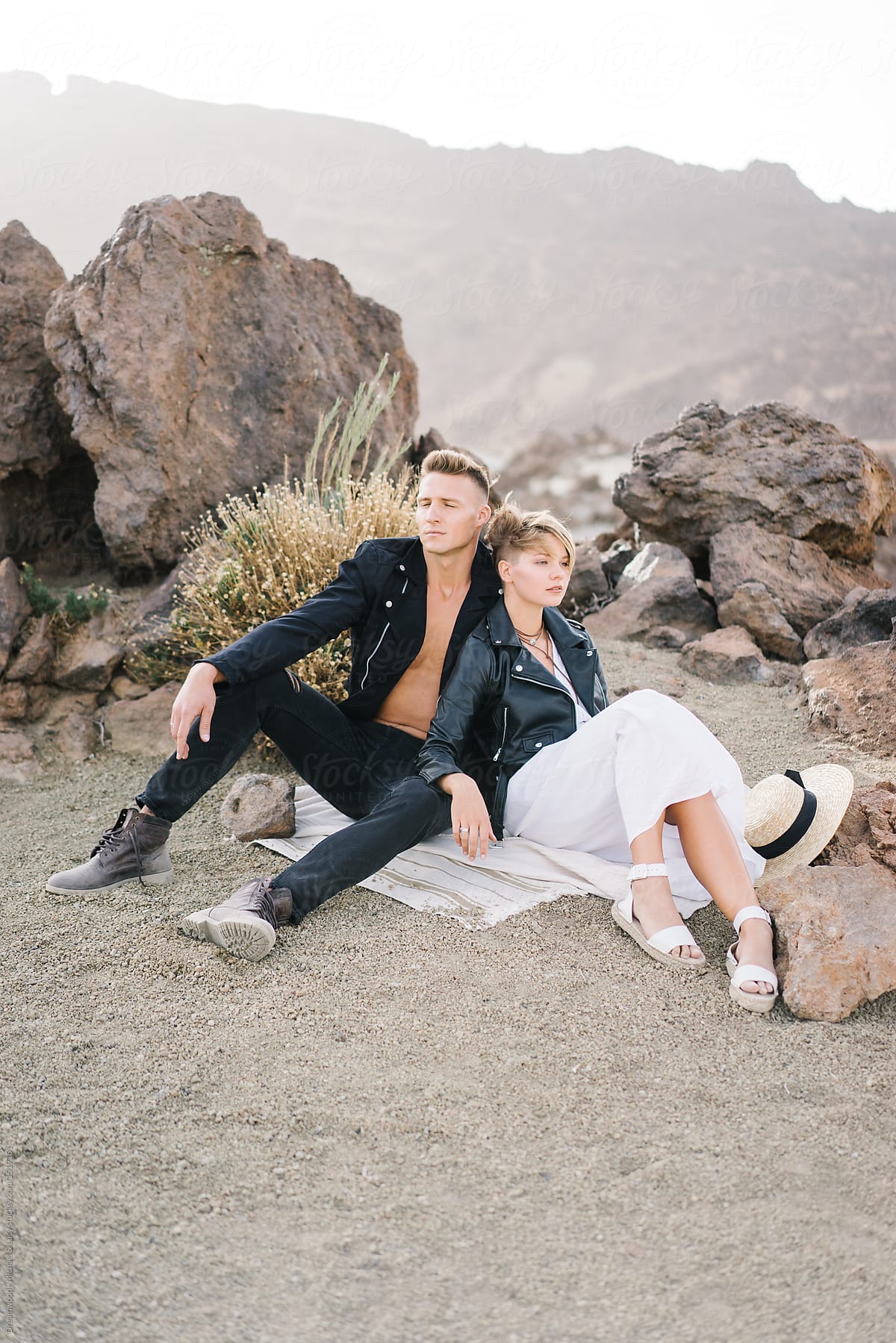 "Couple Posing At Rock" by Stocksy Contributor "Dreamwood Photography ...