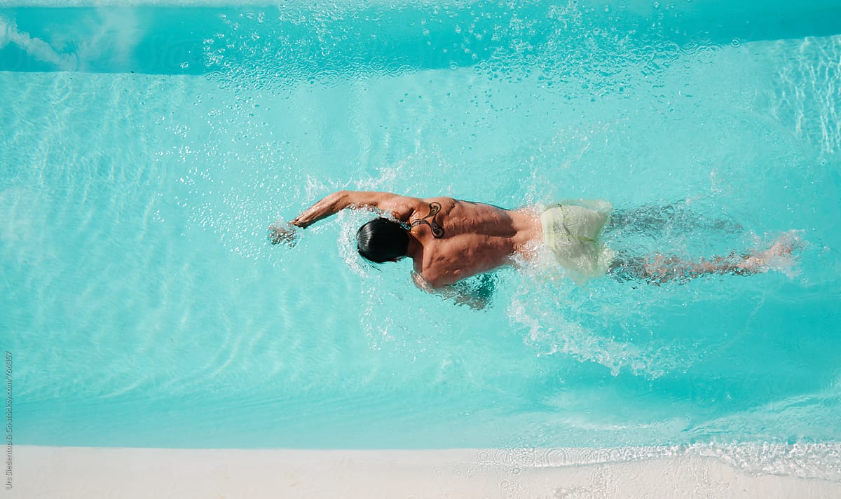 "Freestyle Swimming In Pool" by Stocksy Contributor "Urs Siedentop & Co ...
