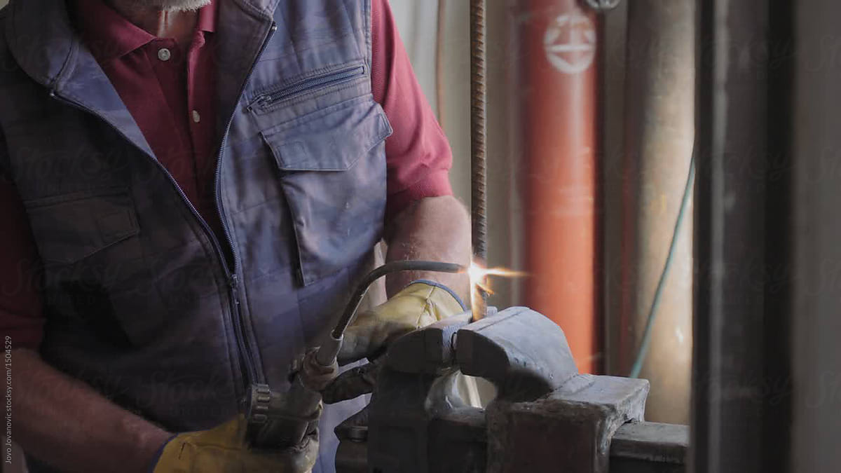 "Man Bending Rebar In A Workshop" by Stocksy Contributor "Jovo ...