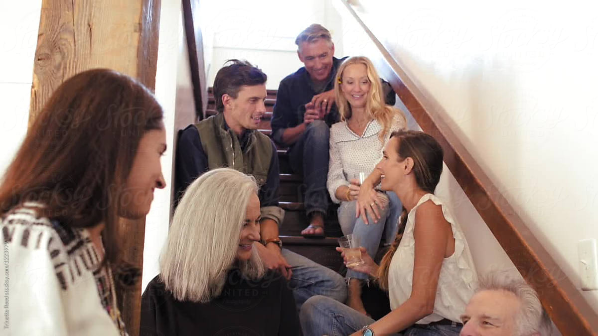 "Multigenerational Friends And Family Hanging Out On Stairs At A House ...
