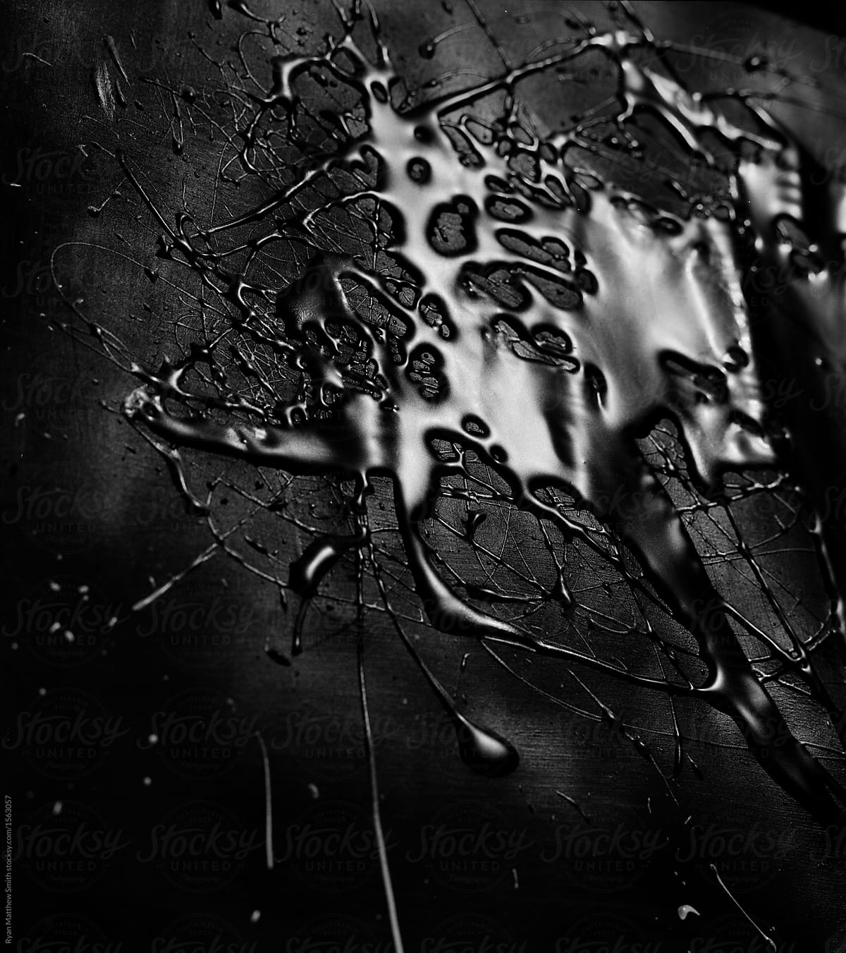 "Black Paint Spill" by Stocksy Contributor "Ryan Matthew Smith" - Stocksy