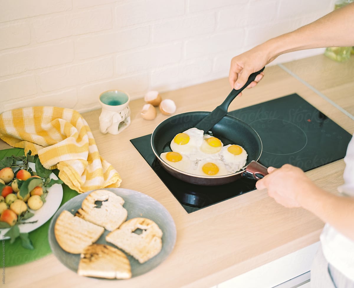 "Cooking Breakfast" by Stocksy Contributor "Milles Team" - Stocksy