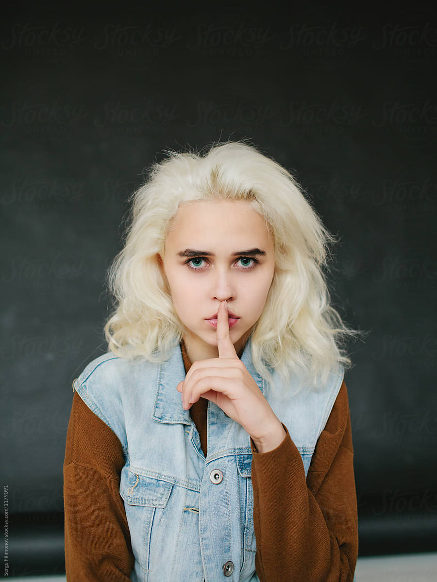 "Model Holding Finger On Lips" by Stocksy Contributor "Serge Filimonov ...