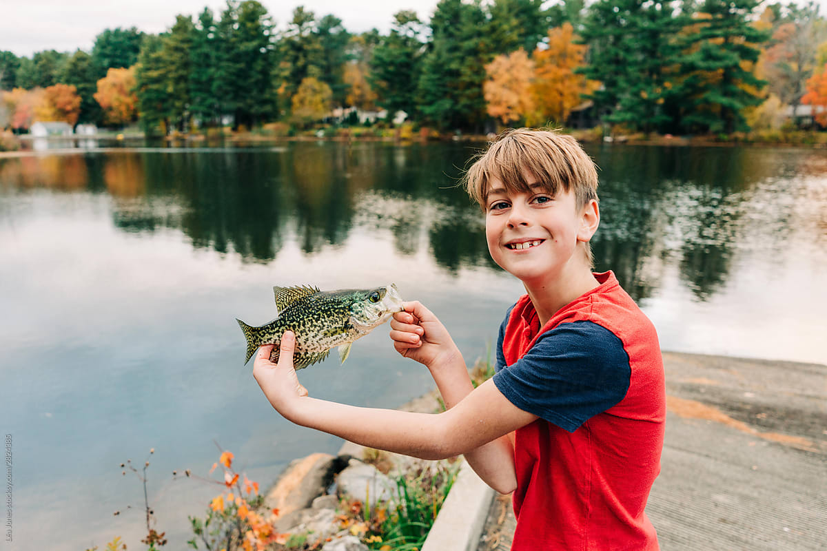 "Boy Proudly Showing The Fish He Caught" by Stocksy Contributor "Lea ...