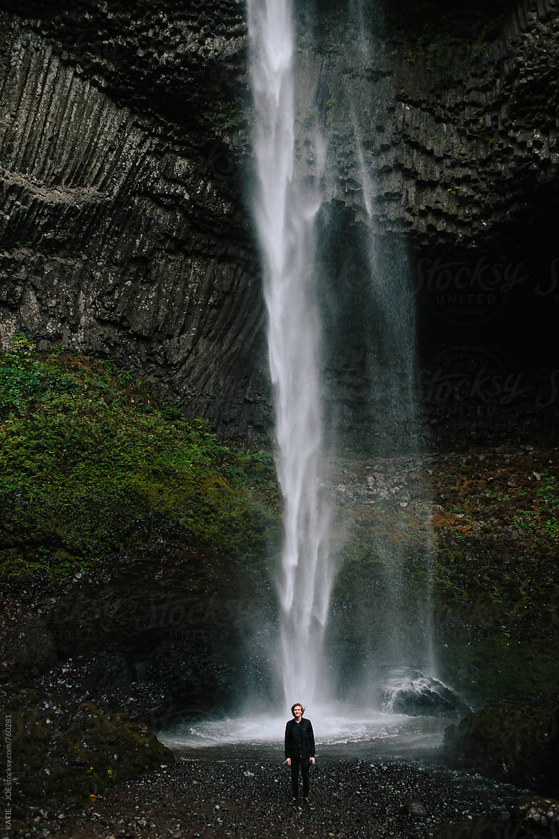 "Man Standing In Front Of A Waterfall" by Stocksy Contributor "KATIE ...