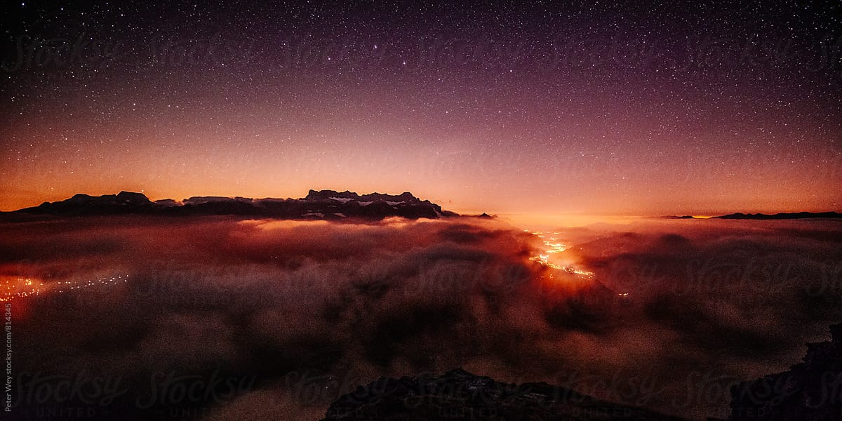 "Nightscape Above Sea Of Fog" by Stocksy Contributor "Peter Wey" - Stocksy