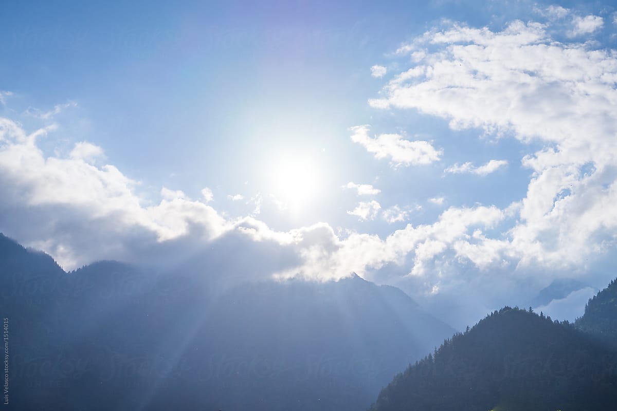 "Sun Over The Mountains." by Stocksy Contributor "Luis Velasco" - Stocksy