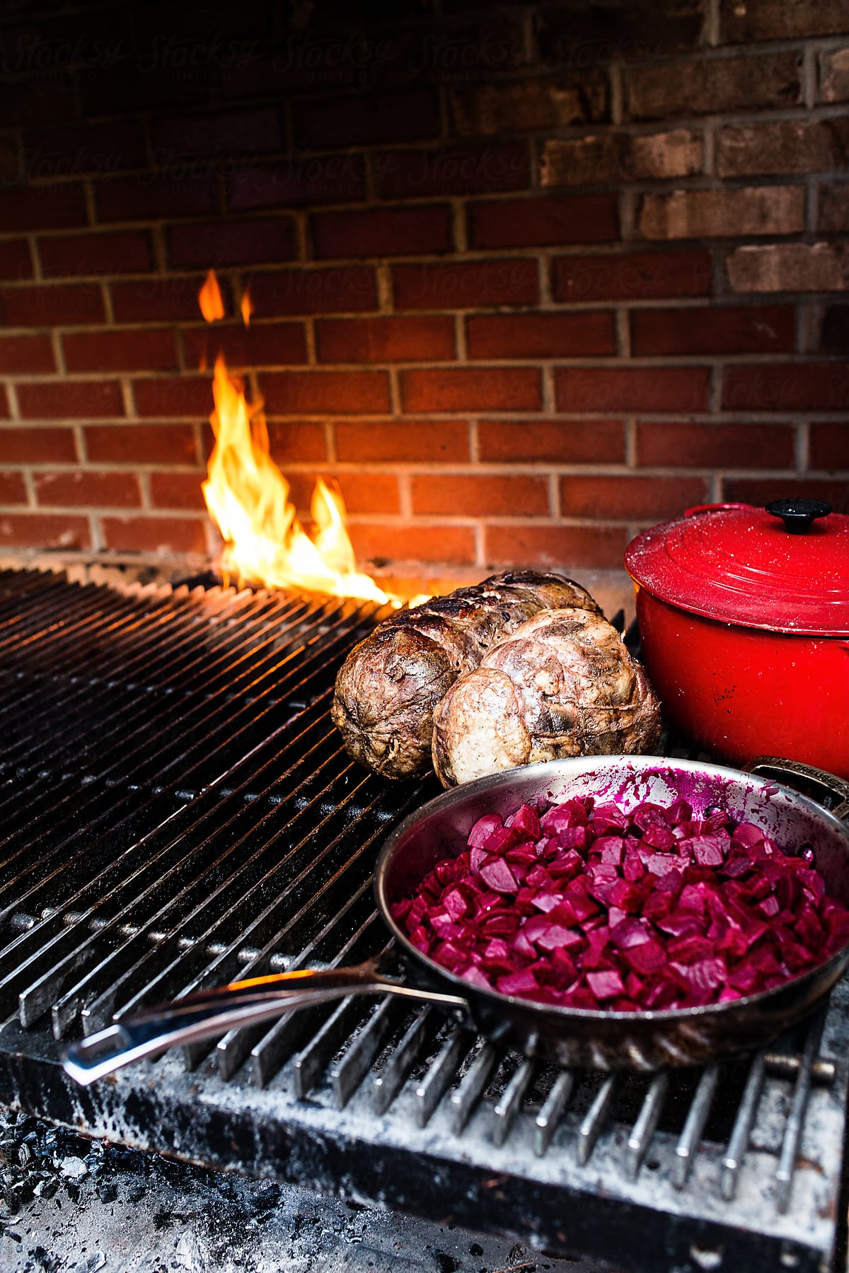 "A Roast And Beets Cooking Over Flames" by Stocksy Contributor "Andrew ...