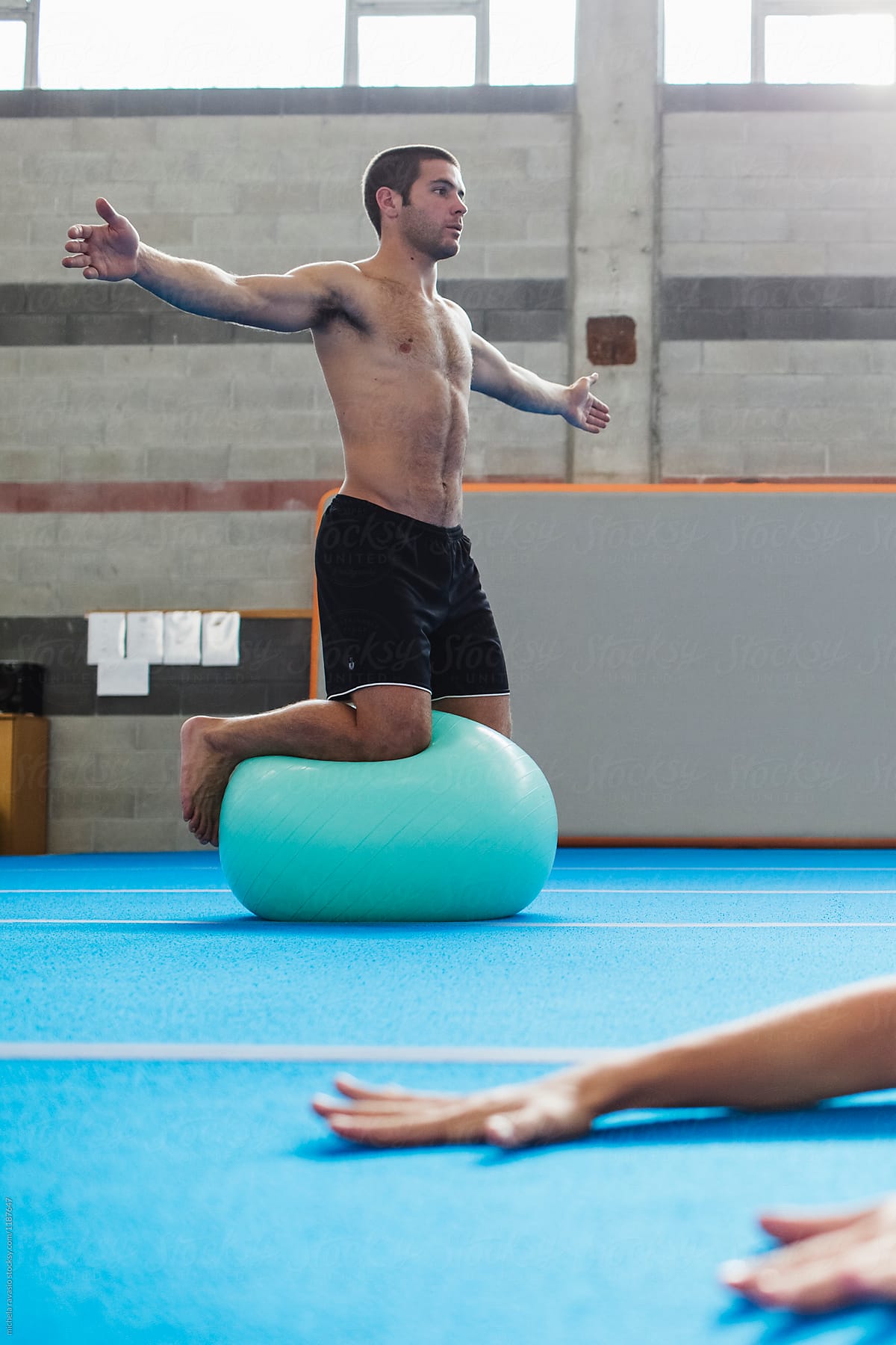 "Man Doing Balance Exercises With Fit Ball" by Stocksy Contributor ...