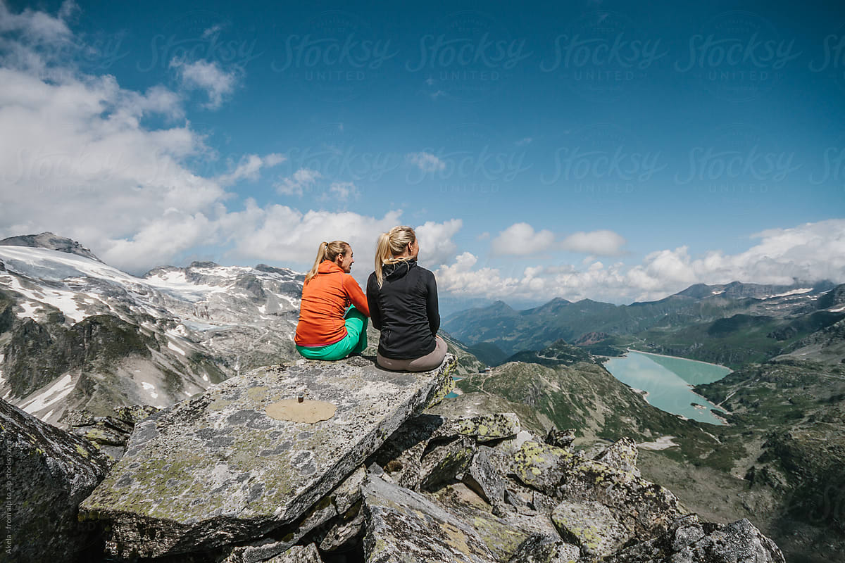 "Female Hiker Friends Sitting In High Alpine Scenery" by Stocksy ...