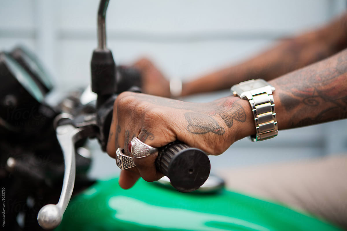 "Tattooed Hands On Motorbike Handlebars" by Stocksy Contributor "Kkgas ...