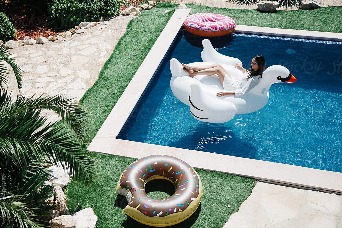 "Floating On A Pool Toy" by Stocksy Contributor "A Model Photographer ...