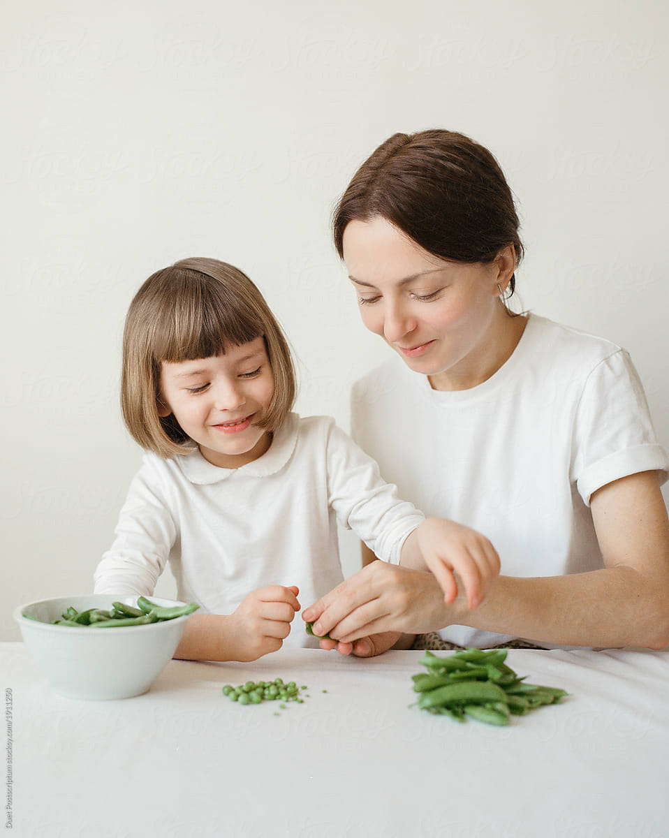 "Mother And Daughter Sorting Peas" by Stocksy Contributor "Duet ...