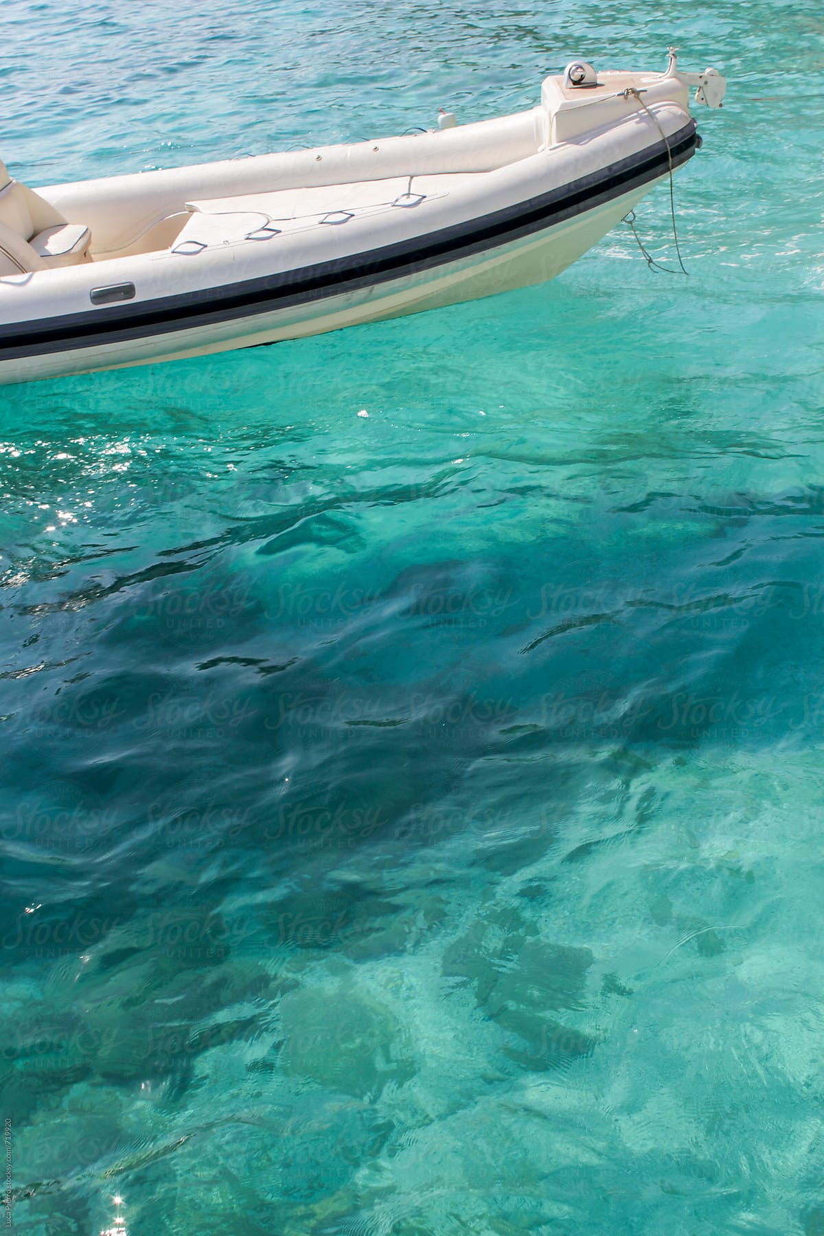 "Boat On The Water" by Stocksy Contributor "Sky-Blue Creative" - Stocksy