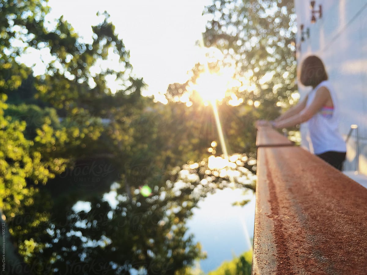 "Woman Looks Towards Sun" by Stocksy Contributor "Holly Clark" - Stocksy