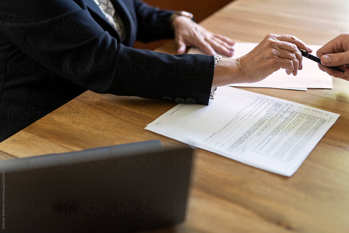 "Handing Over A Pen For Signing Documents" by Stocksy Contributor "Kat ...