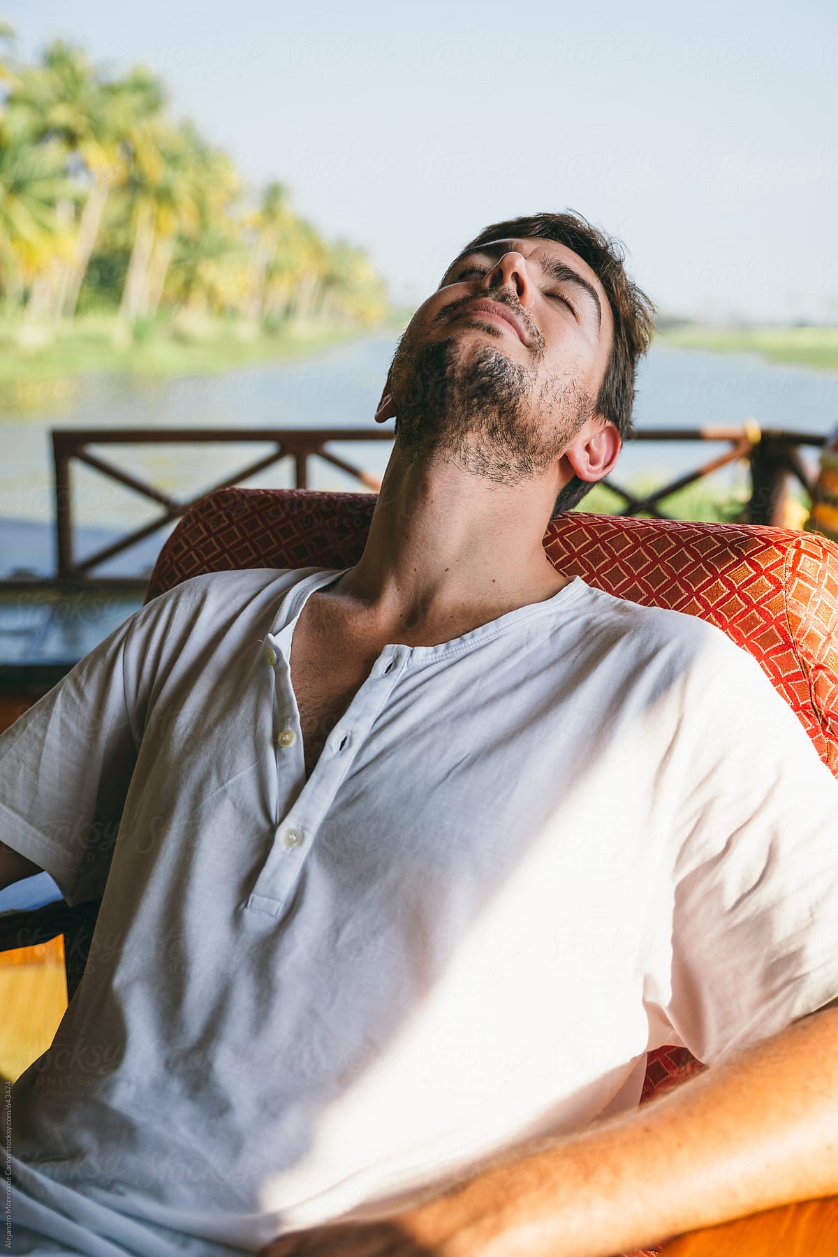 "Young Man Relaxing On A River Boat Cruise. Kerala Backwaters, India ...