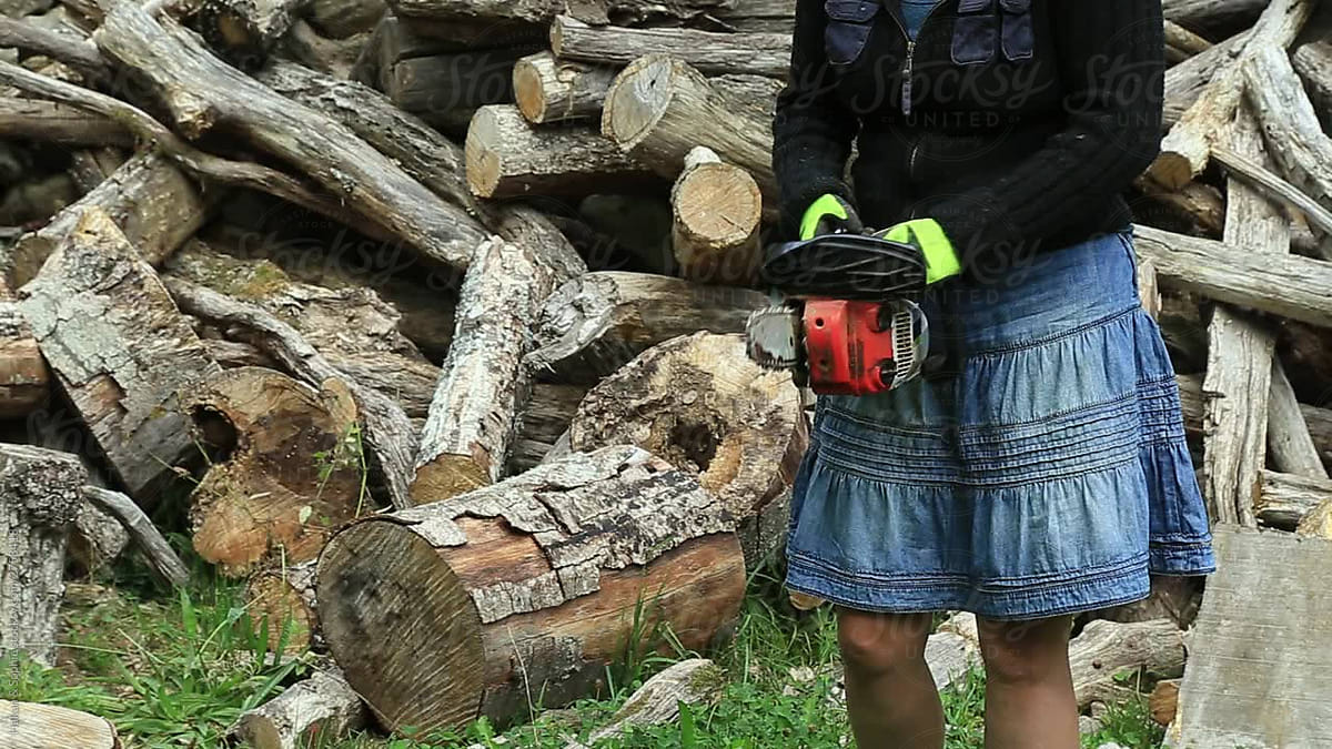 "Woman Wearing A Skirt Is Starting Her Chainsaw" by Stocksy Contributor ...