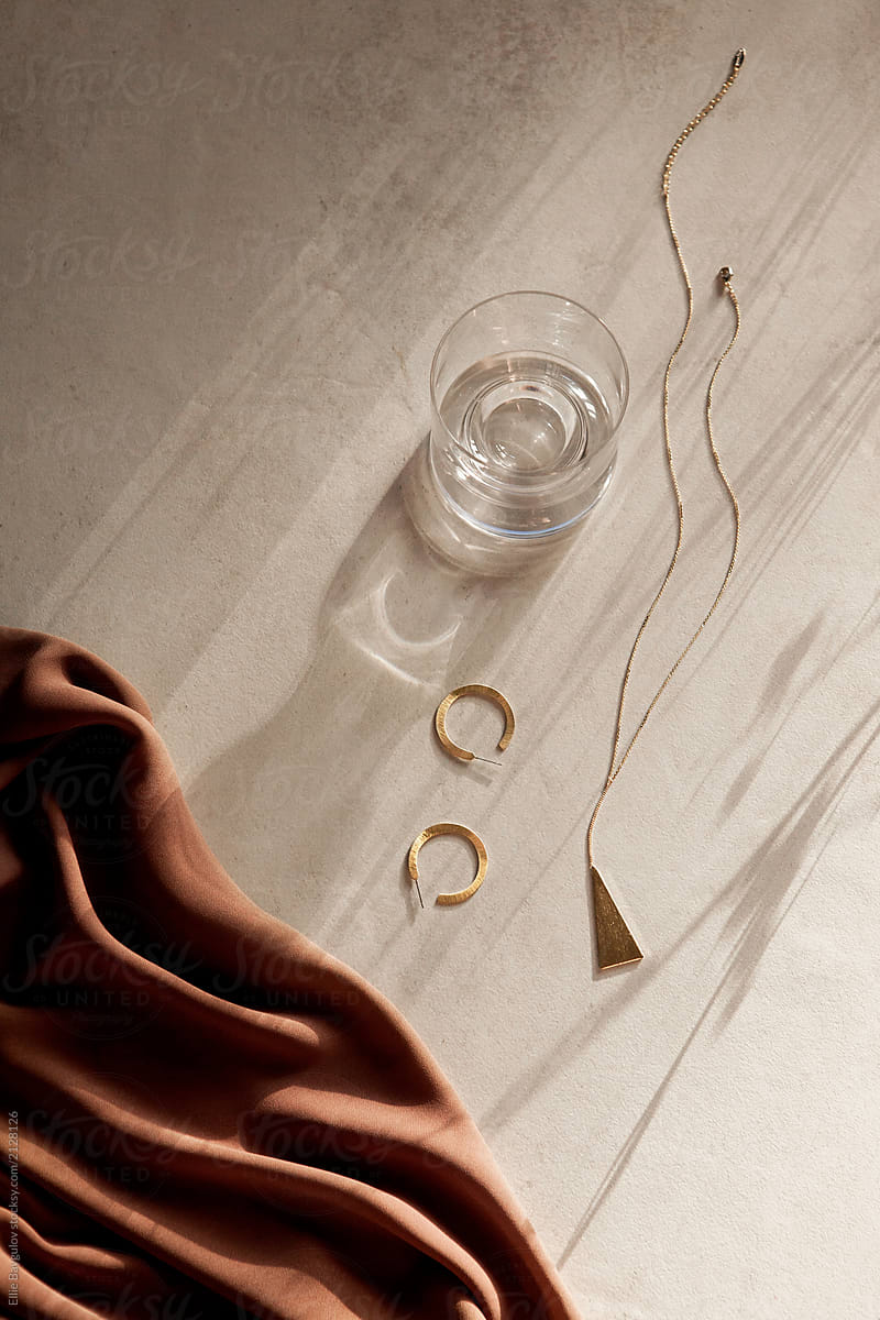 "Gold Jewelry Laying In Evening Sunlight" by Stocksy Contributor "Ellie ...