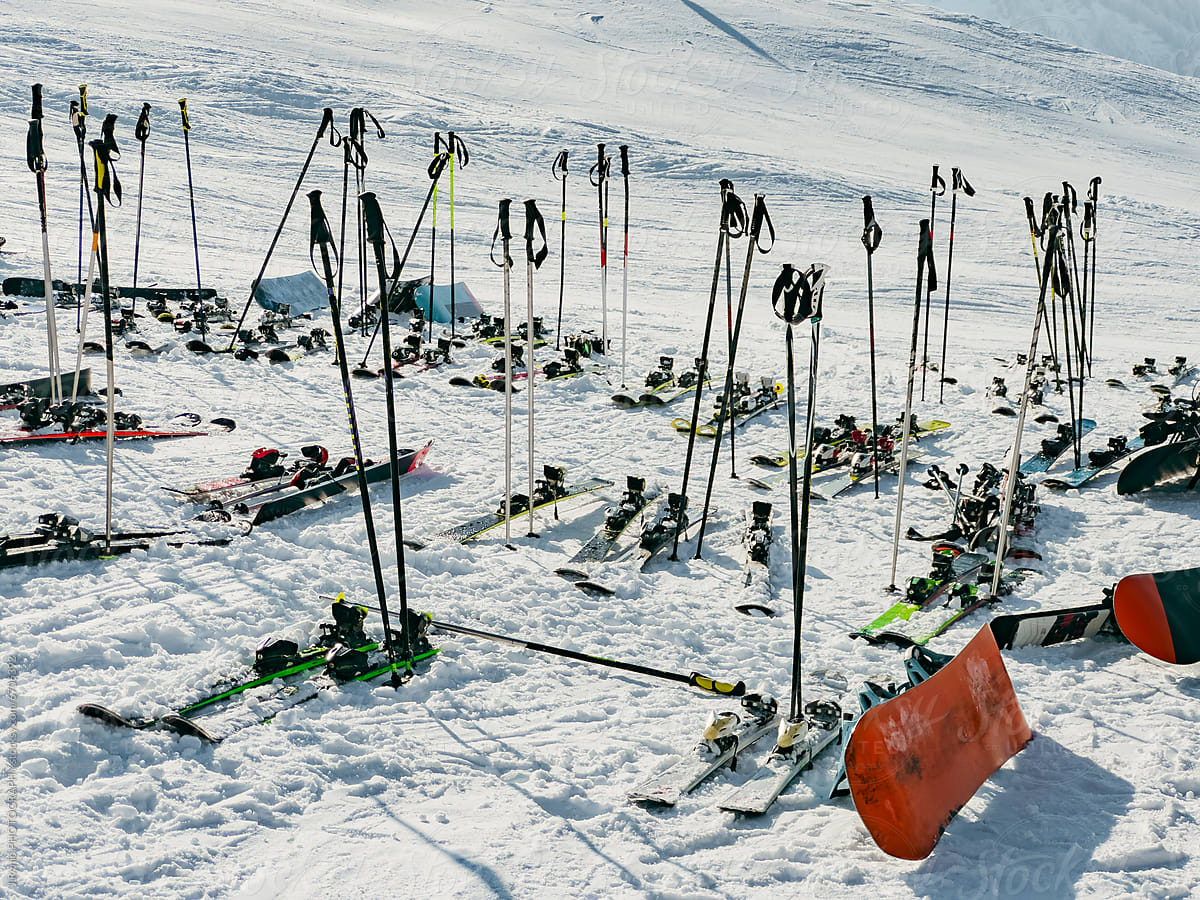"Skis And Snowboards Resting On A Snowy Slope" by Stocksy Contributor ...