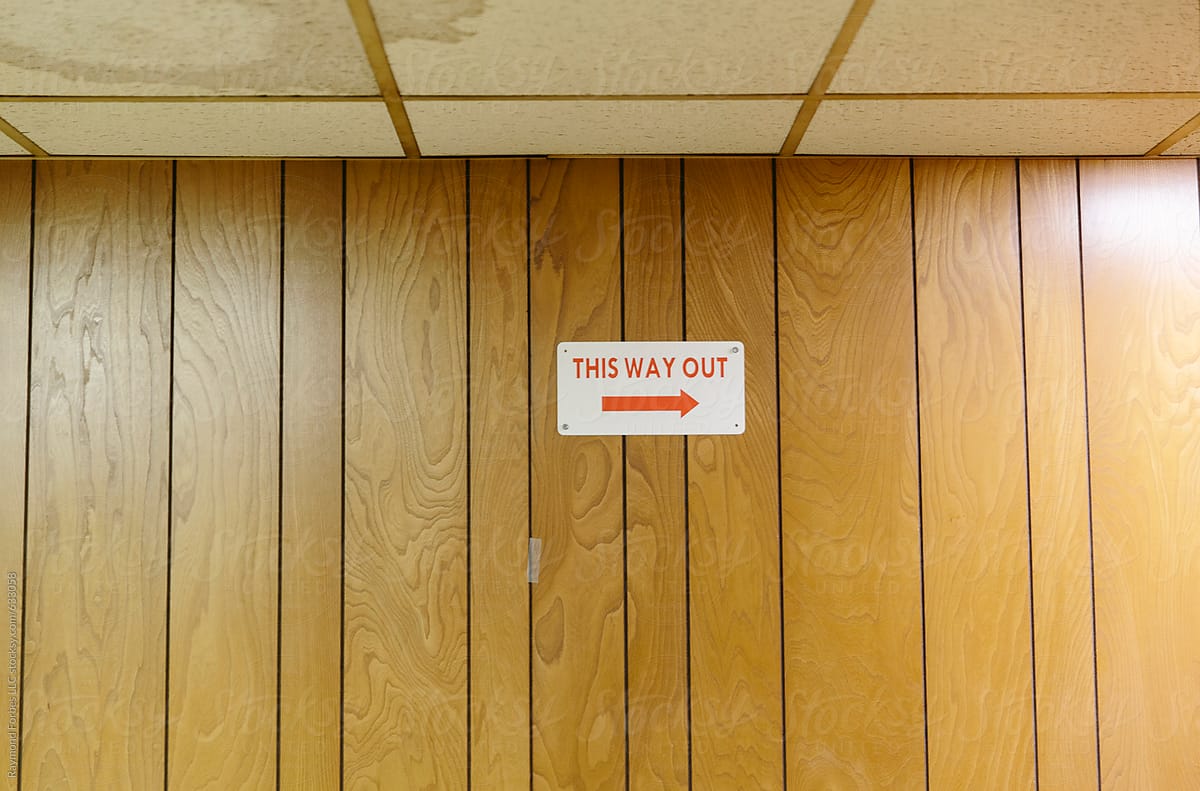 "This Way Out Exit Sign On Wood Paneling" by Stocksy Contributor ...