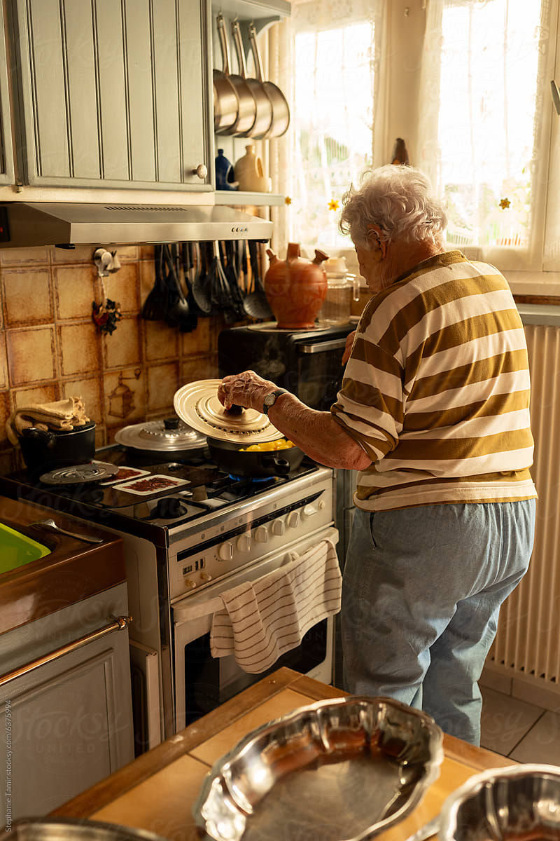 "Grandma’s Cooking In Her Kitchen." by Stocksy Contributor "Stephanie ...