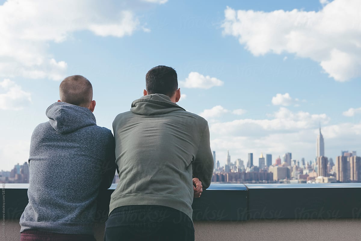 "Gay Men Friends Hanging Out On A Rooftop Enjoying The View In New York ...