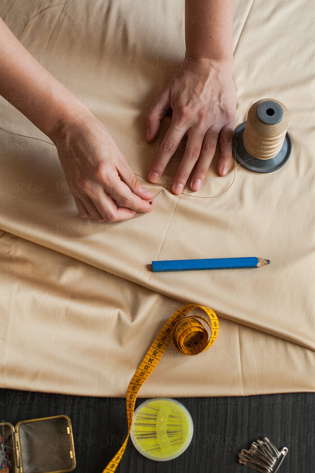 "Tailoring Process" by Stocksy Contributor "Jelena Jojic Tomic" - Stocksy