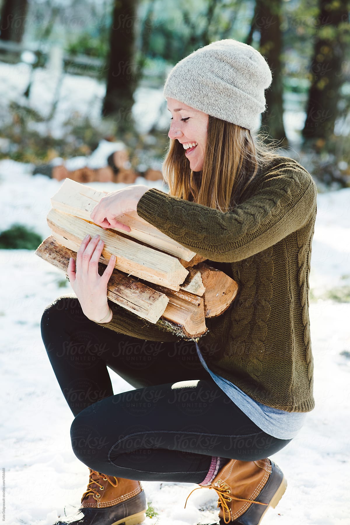 "A Young Blonde Woman Is Collecting Firewood To Bring Inside" by ...