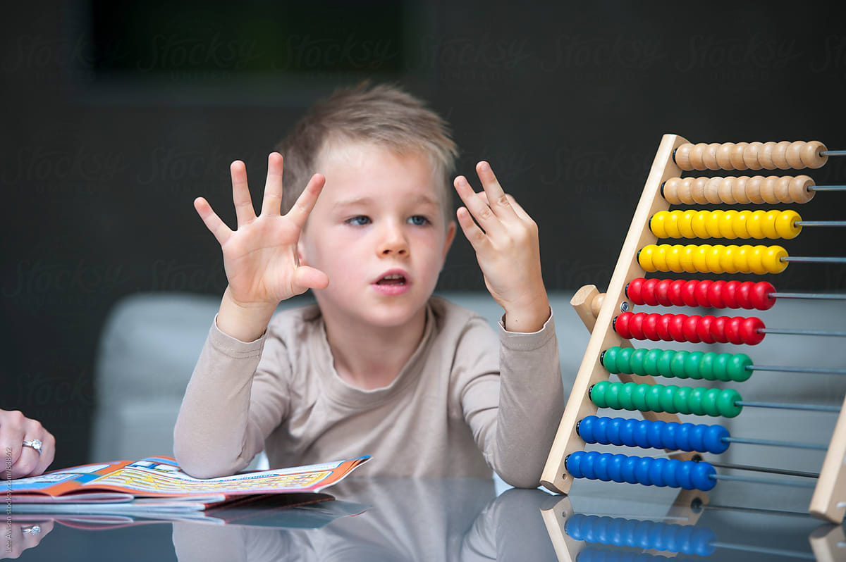 Young Boy Counting On Fingers By Lee Avison