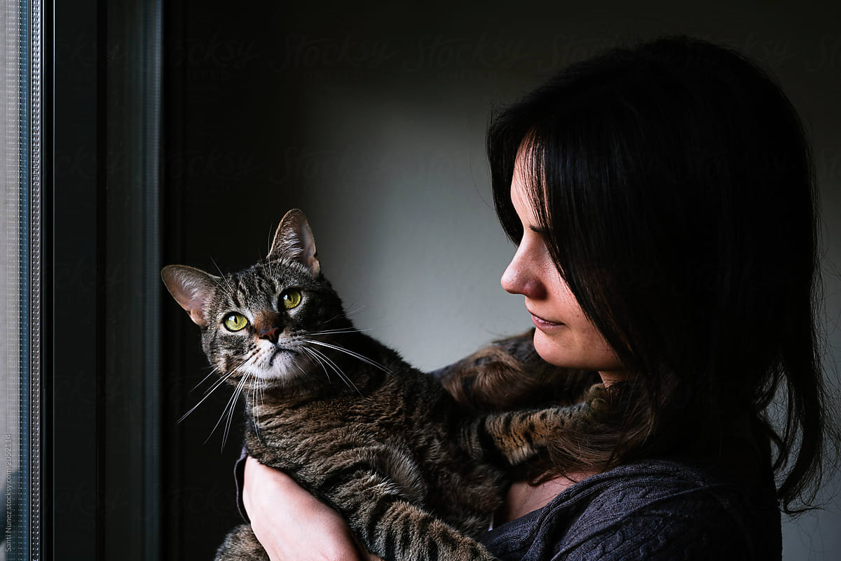 "Lovely Woman Taking Care Of Her Cat At Home." by Stocksy Contributor ...