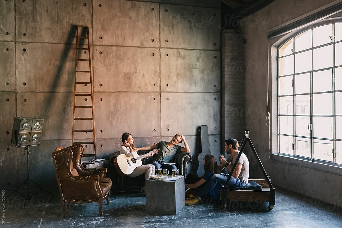 "Friends Relaxing At Home" by Stocksy Contributor "Koganami Studio ...