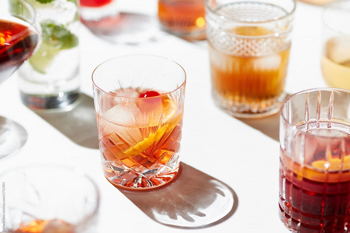 "Composed Crystal Glasses With Cocktails" by Stocksy Contributor "Martí ...