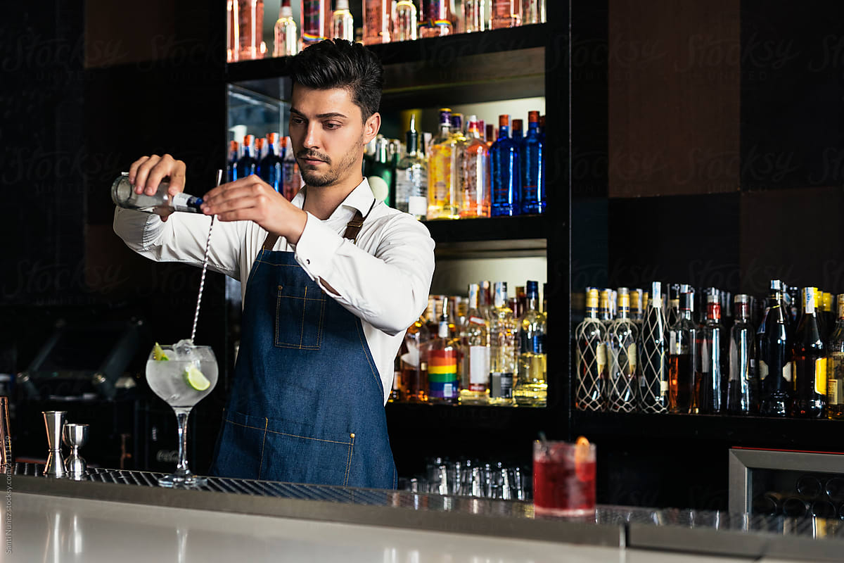 "Professional Young Bartender Working" by Stocksy Contributor "Santi ...