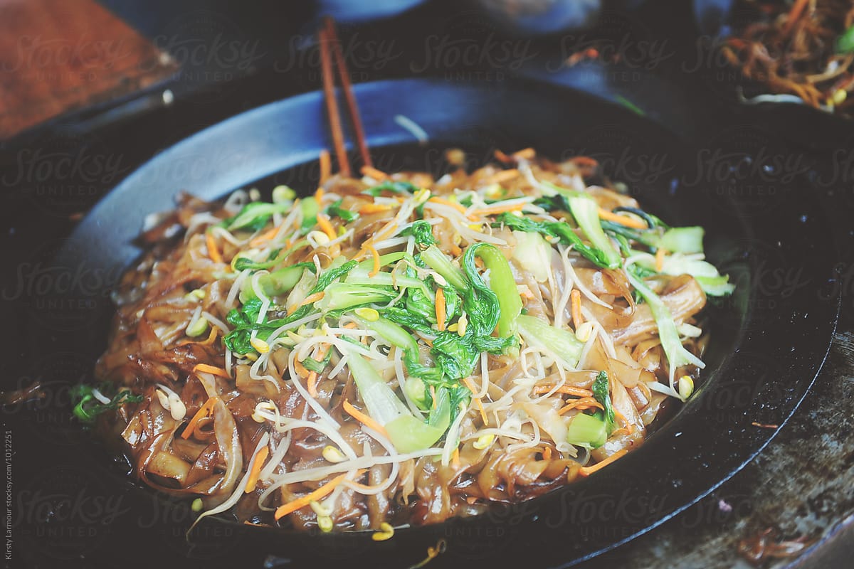 "A Wok Full Of Noodles And Vegetables" by Stocksy Contributor "Kirsty ...