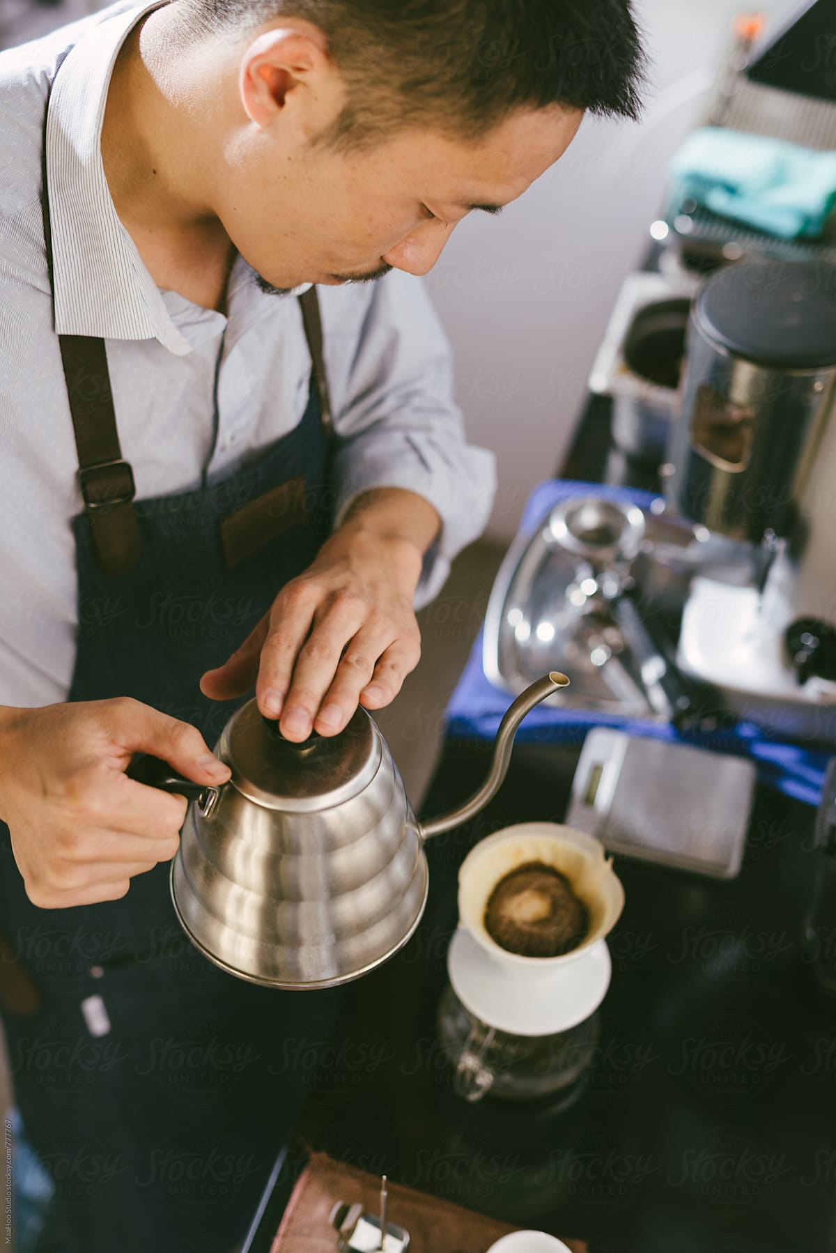 "Young Man Preparing Coffee" by Stocksy Contributor "MaaHoo" - Stocksy