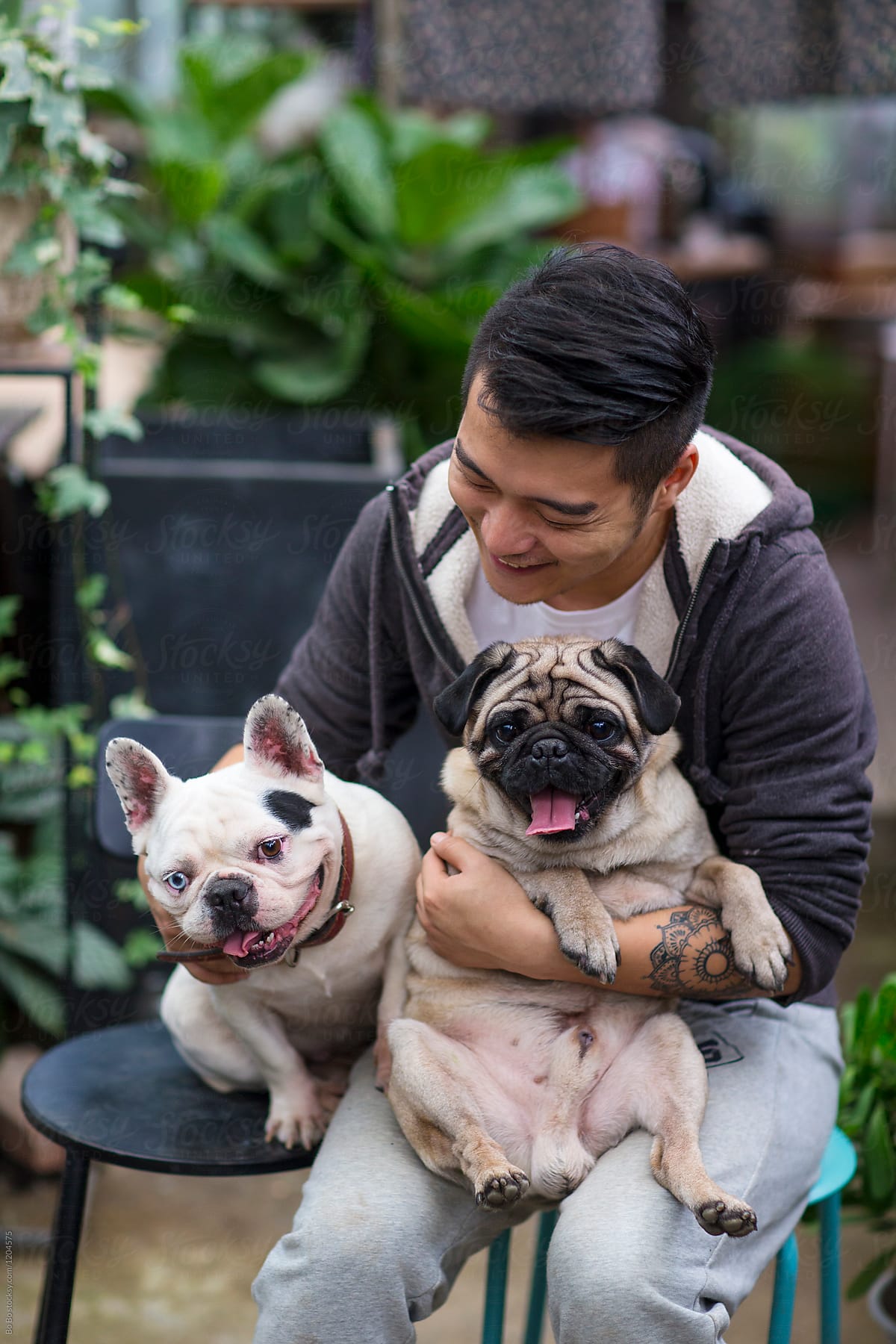 "Young Asian Man With His Dog In The Garden" by Stocksy Contributor "Bo ...