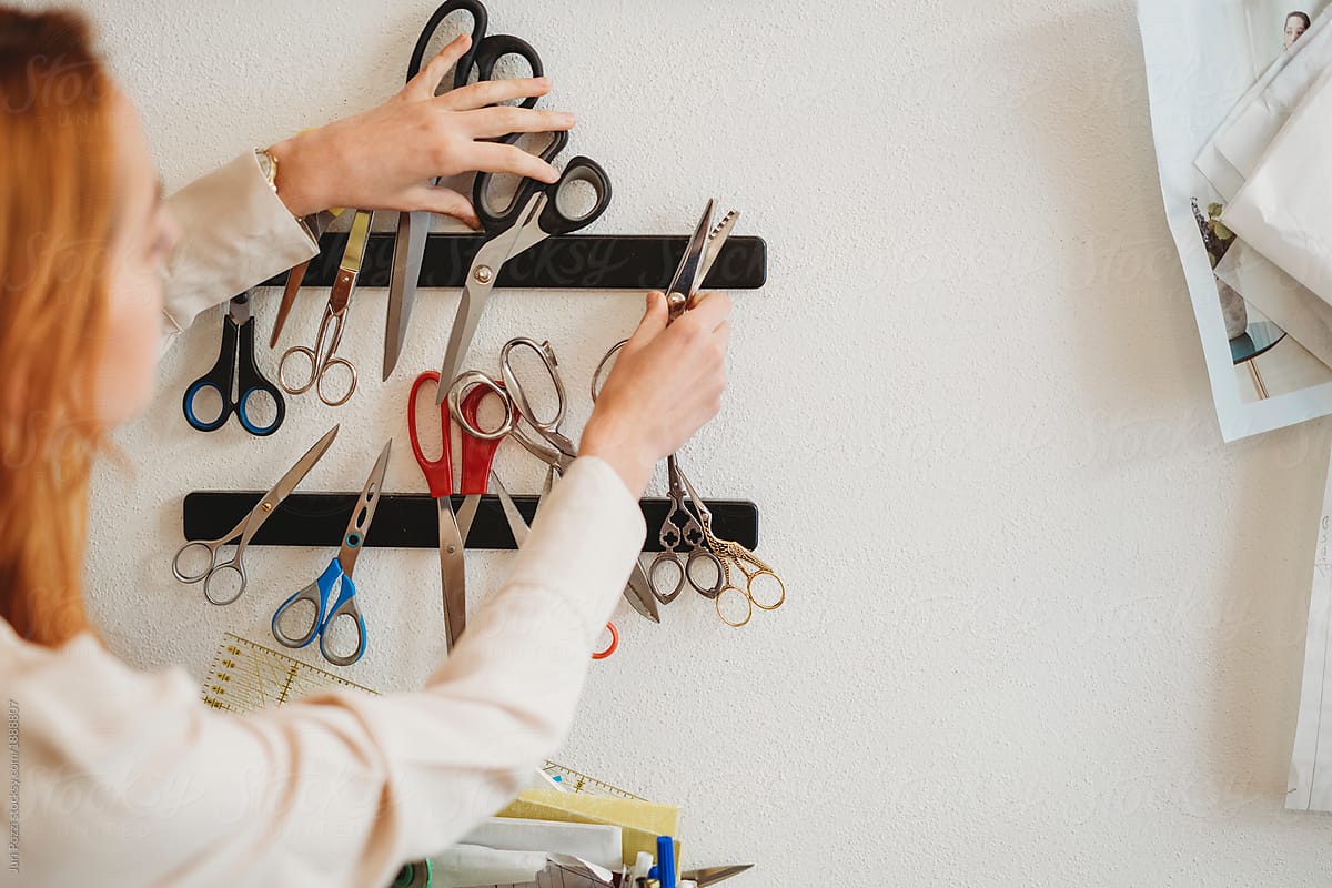 "Young Female Fashion Designer Organizes The Scissors On Her Studio ...